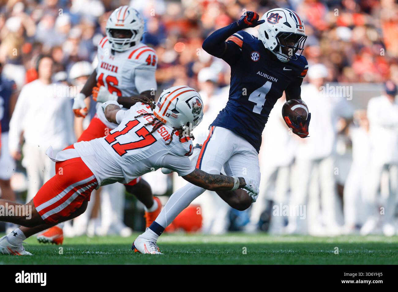 Auburn wide receiver Malcolm Simmons (4) is tripped up by Mercer ...