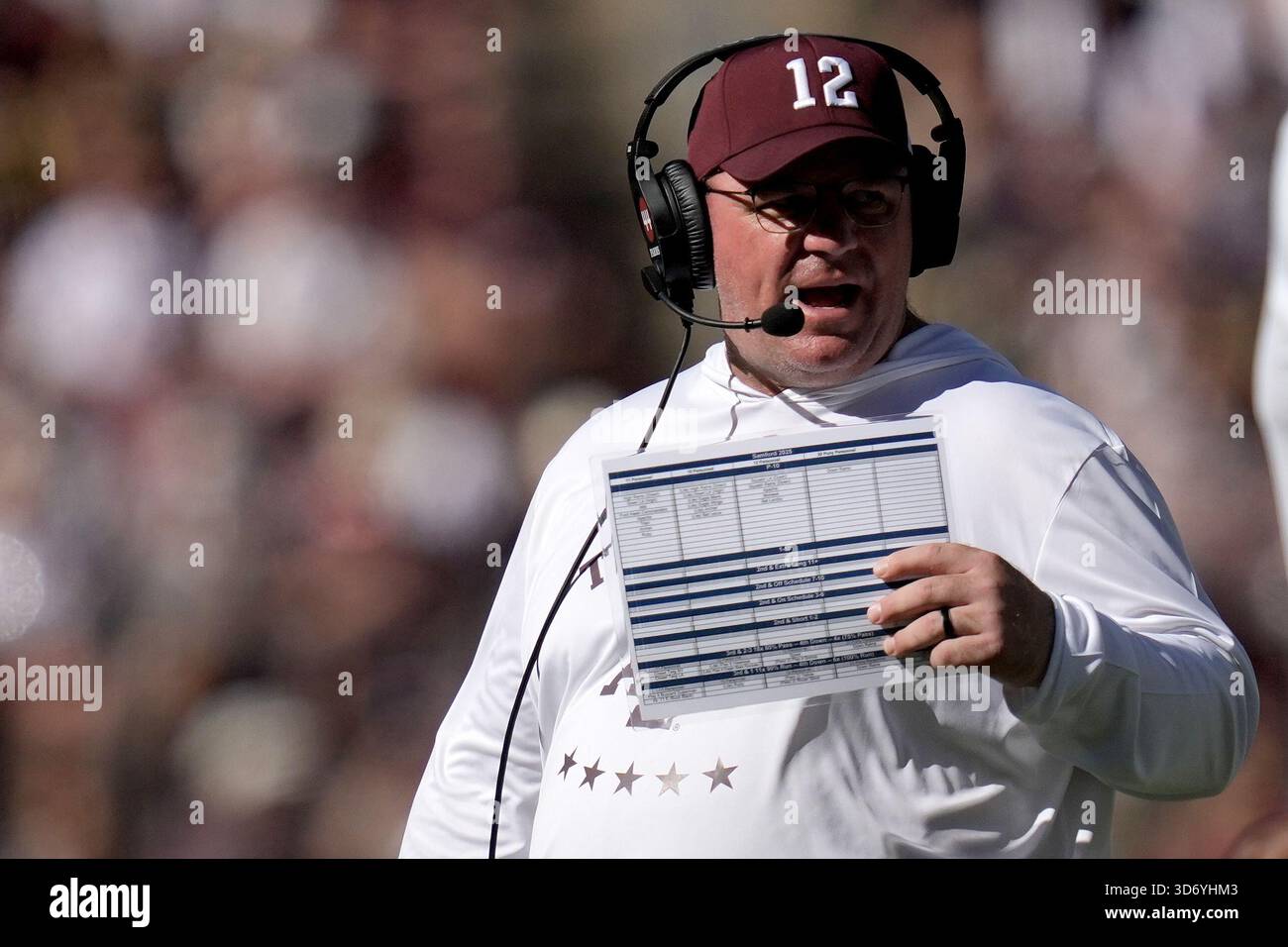 Texas A&M head coach Mike Elko talks to his staff during an injury time ...