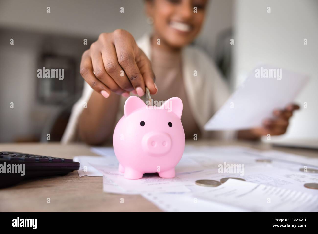Happy young Black woman caring for savings, financial literacy Stock ...