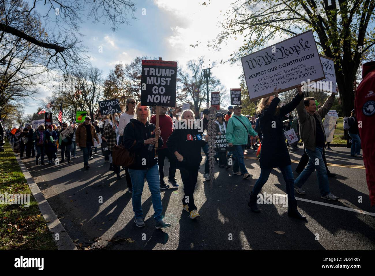 People march down 17th street while participating in the "Remove the ...