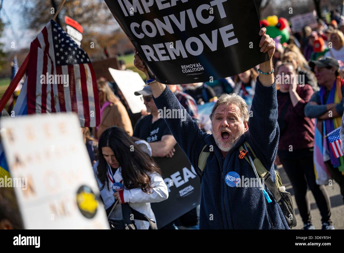 A participant the "Remove the Regime" protest chants while waiting for ...