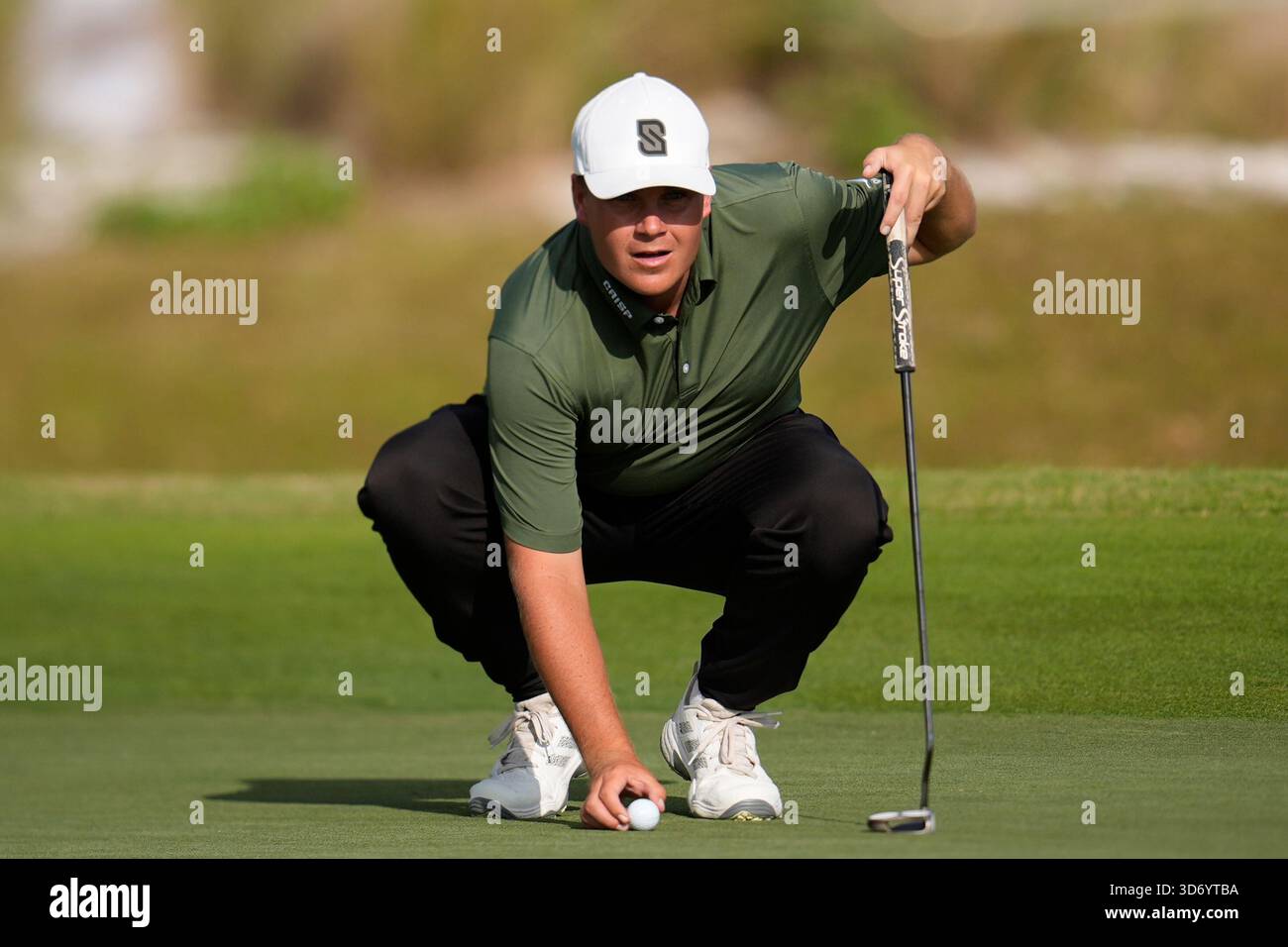 Sami Valimaki places his ball on the 13th green during the third round ...