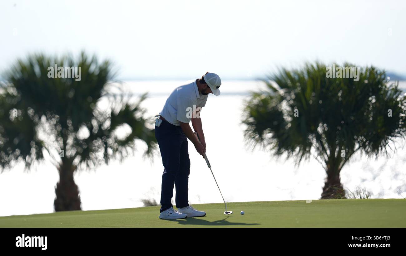 Quade Cummins putts on the 13th green during the third round of the RSM ...