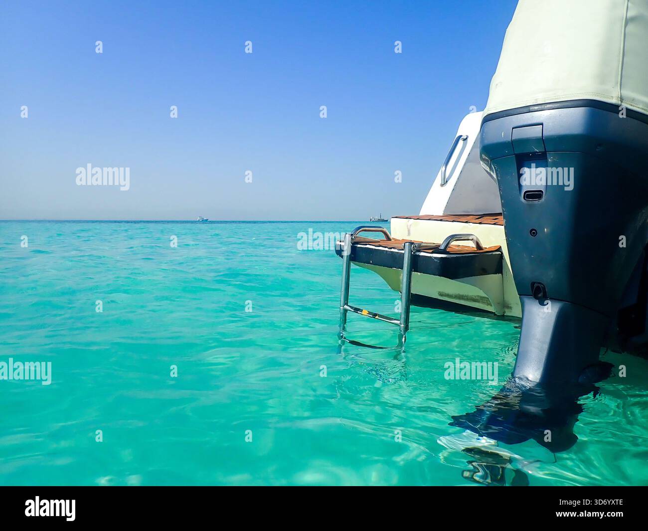 View of small yacht and the turquoise blue waters of Bayoud sandbank ...
