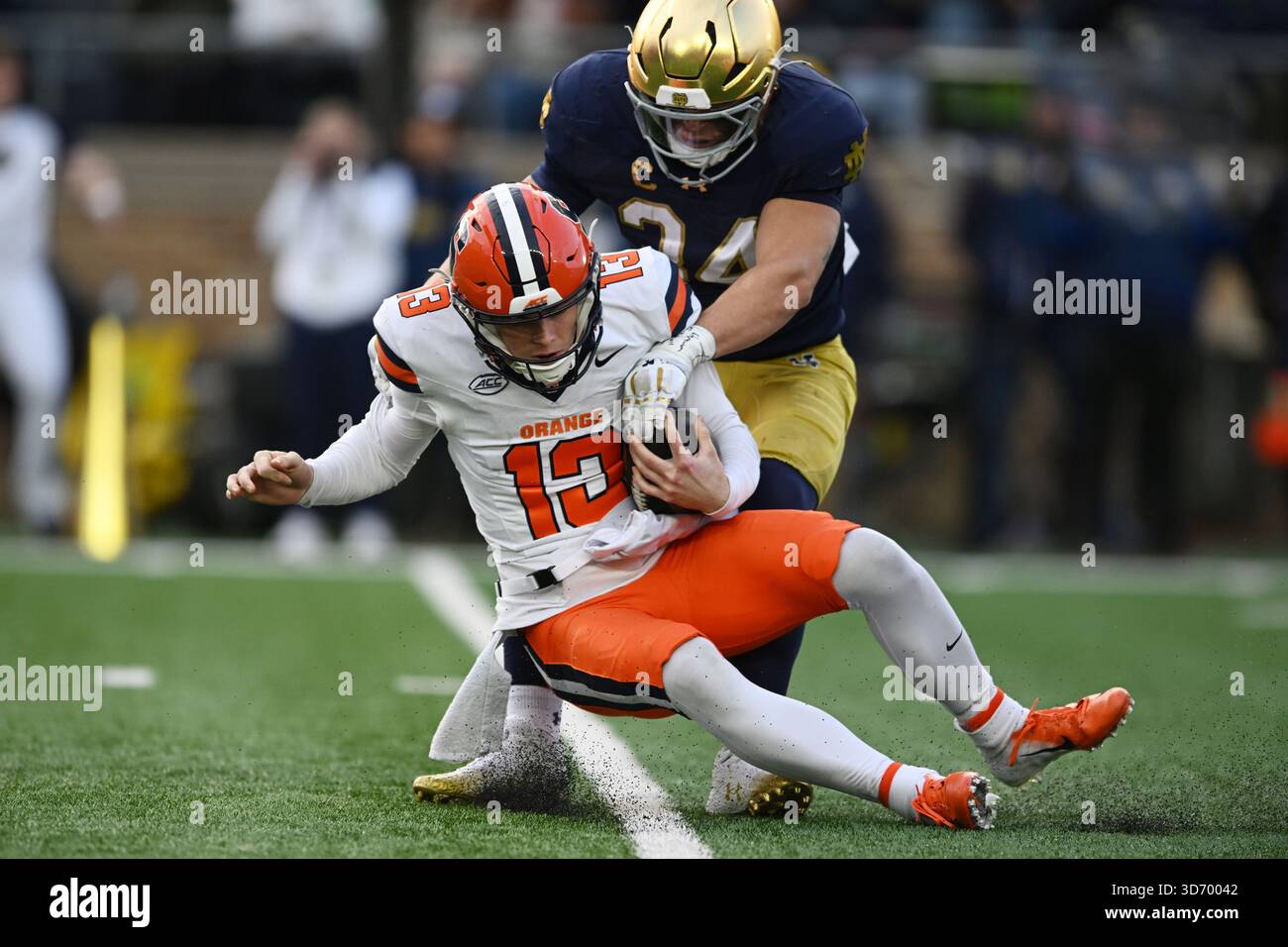 Syracuse quarterback Joseph Filardi (13) is sacked by Notre Dame's ...