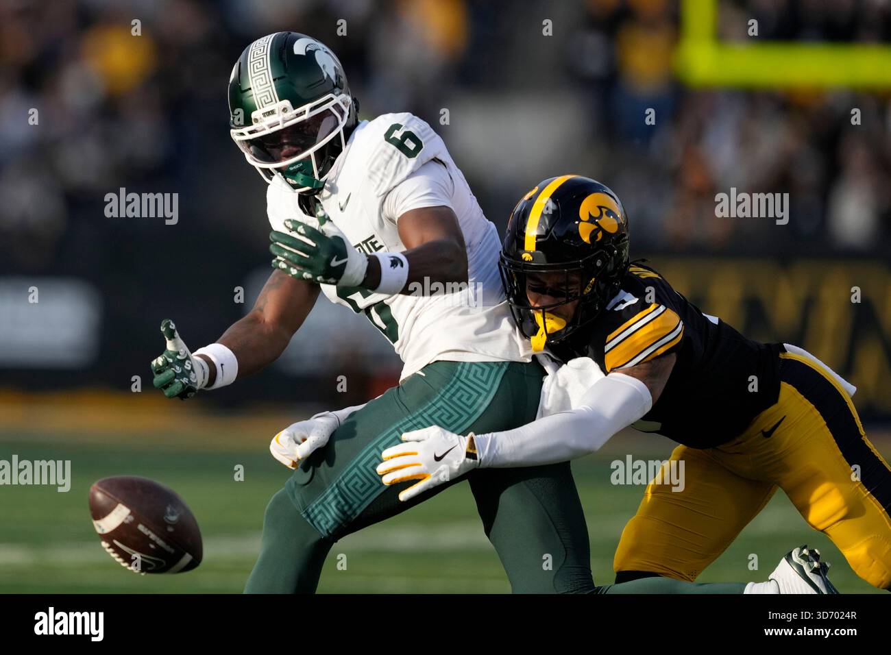 Iowa defensive back Jaylen Watson (3) breaks up a pass intended for ...