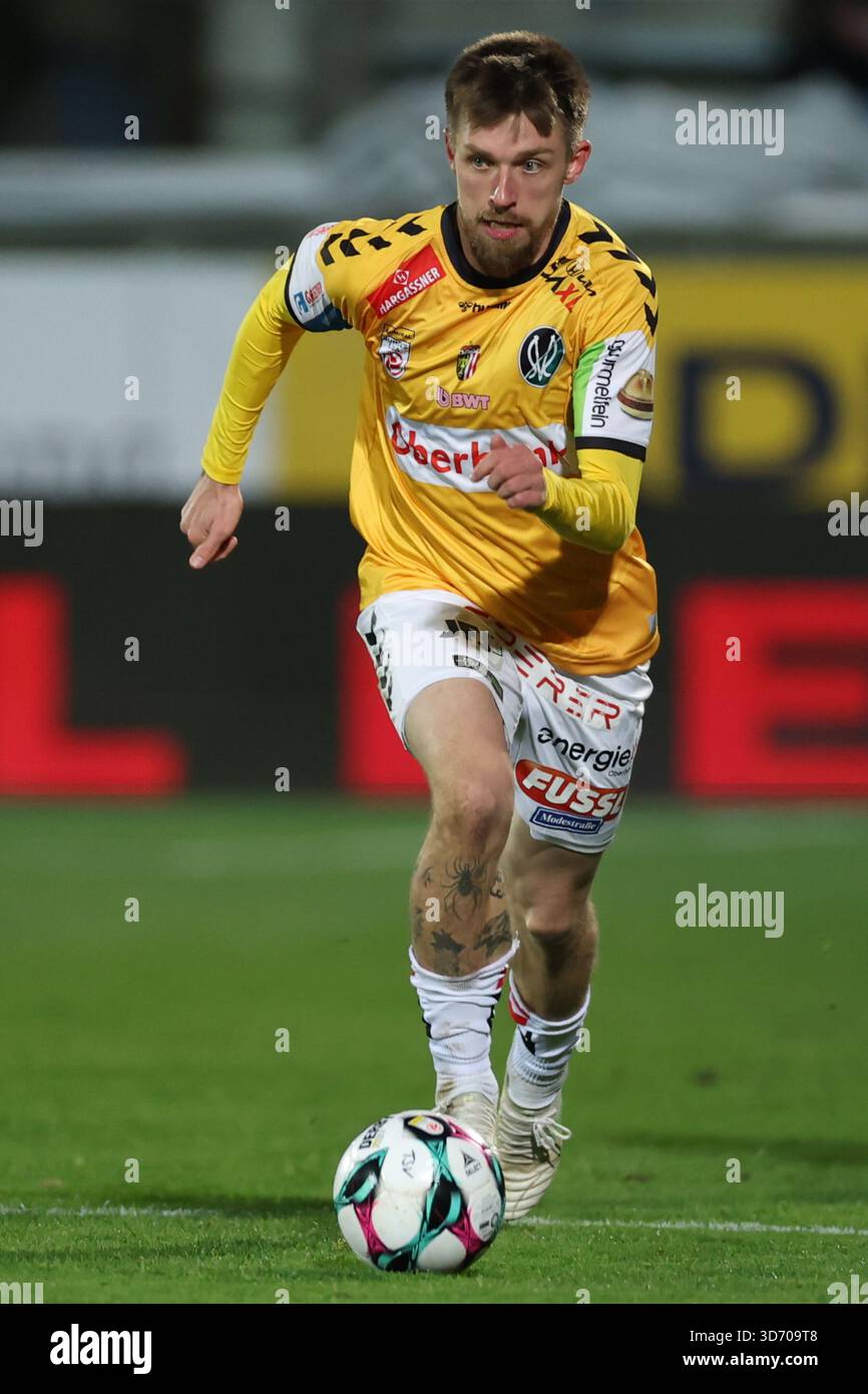 The image shows Philipp Pomer (Ried) running with the ball, at the ...