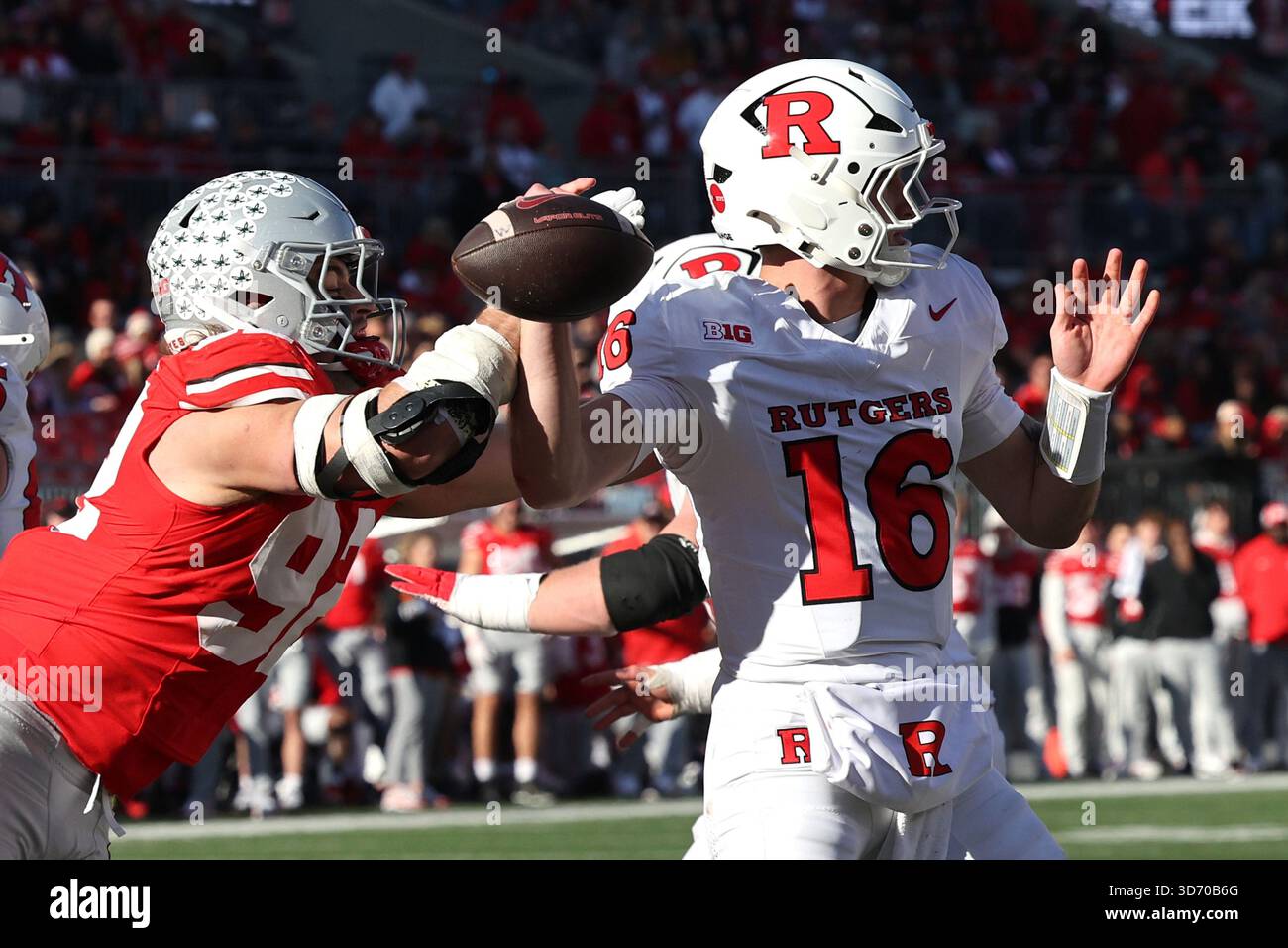 Ohio State Buckeyes Caden Curry (92) knocks the ball free from Rutgers ...
