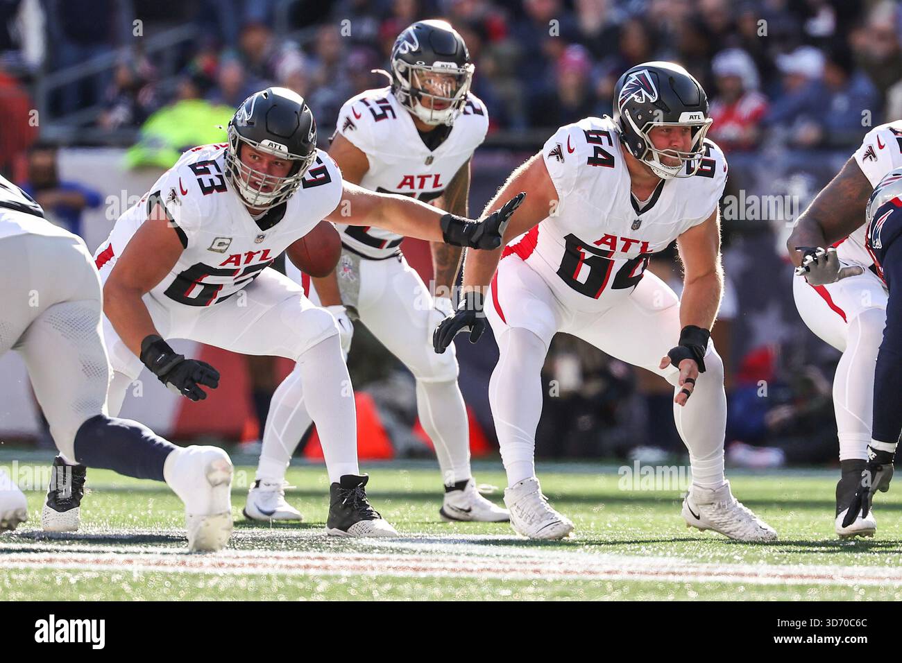 Atlanta Falcons' Chris Lindstrom (63) and Ryan Neuzil (64) look to ...