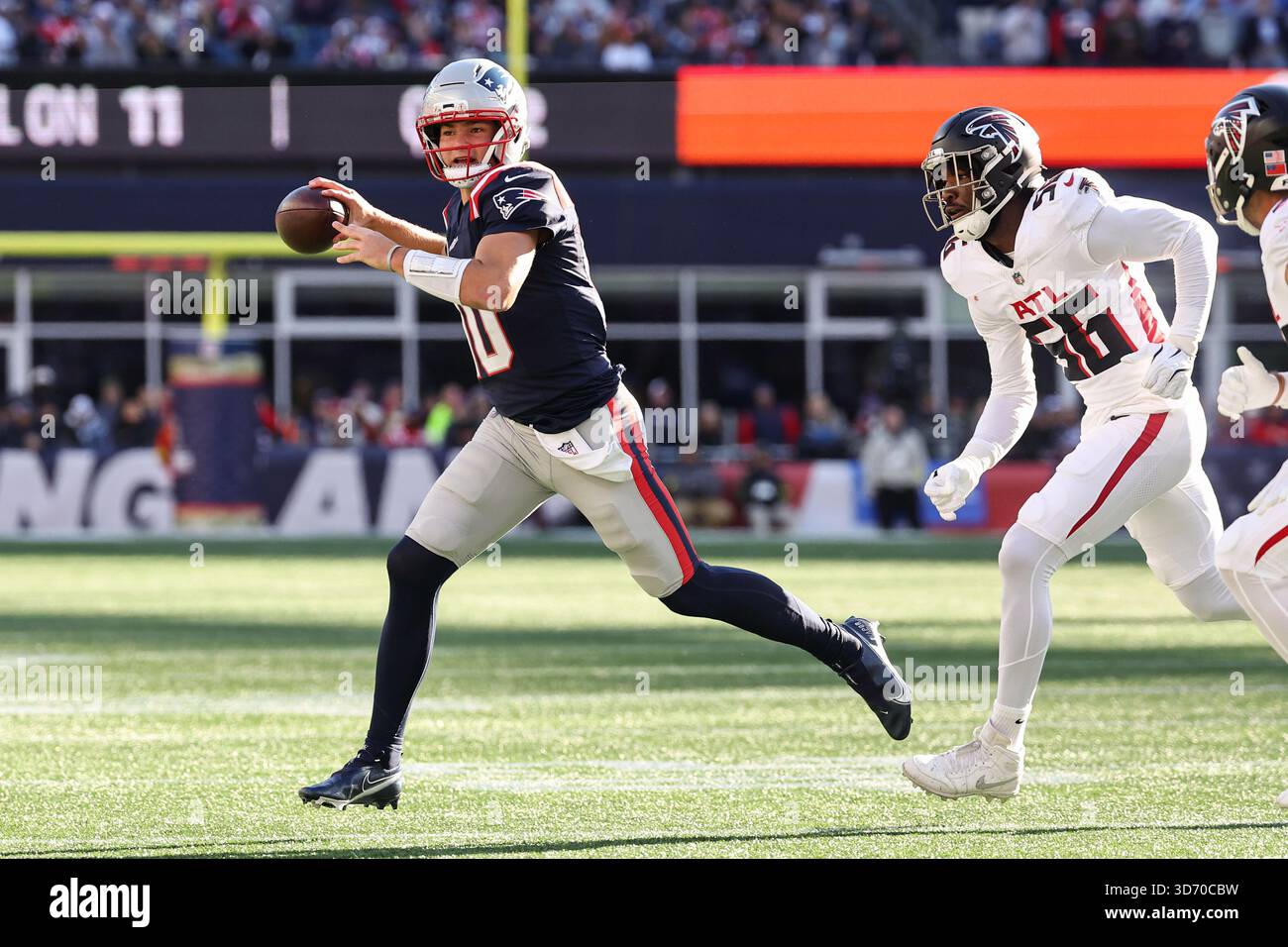 New England Patriots quarterback Drake Maye throws on the run against ...