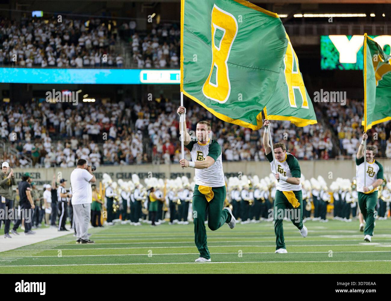 November 15, 2025 Baylor Bears cheerleaders run out with the flags ...