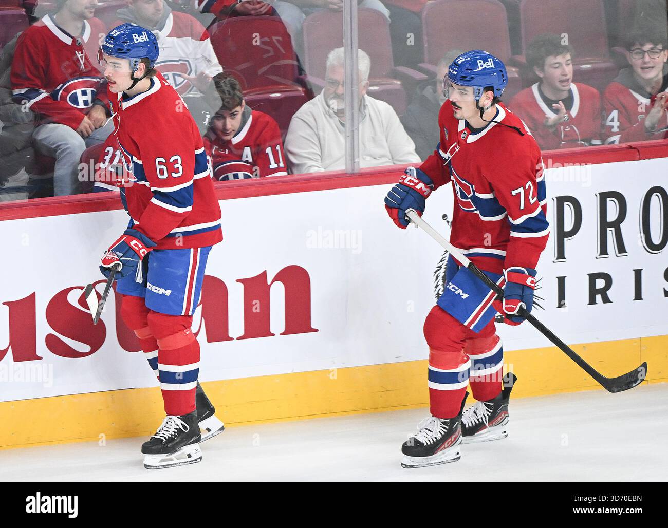 Montreal Canadiens' Florian Xhekaj (63) skates alongside his brother ...