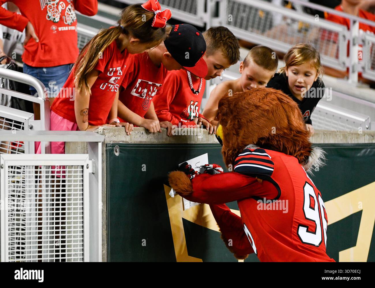 November 15, 2025 Utah Utes mascot signs a photo for fans during the ...