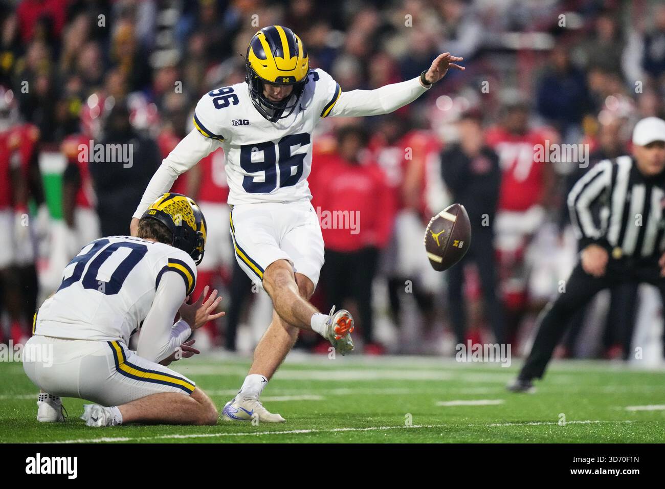 Michigan kicker Dominic Zvada (96), with punter Hudson Hollenbeck (90 ...