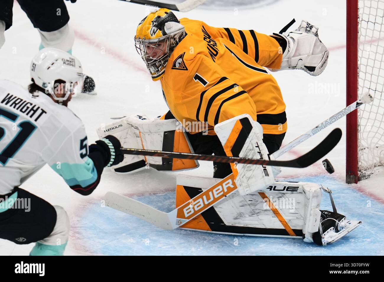 Seattle Kraken's Shane Wright (51) can't get his stick on a loose puck ...