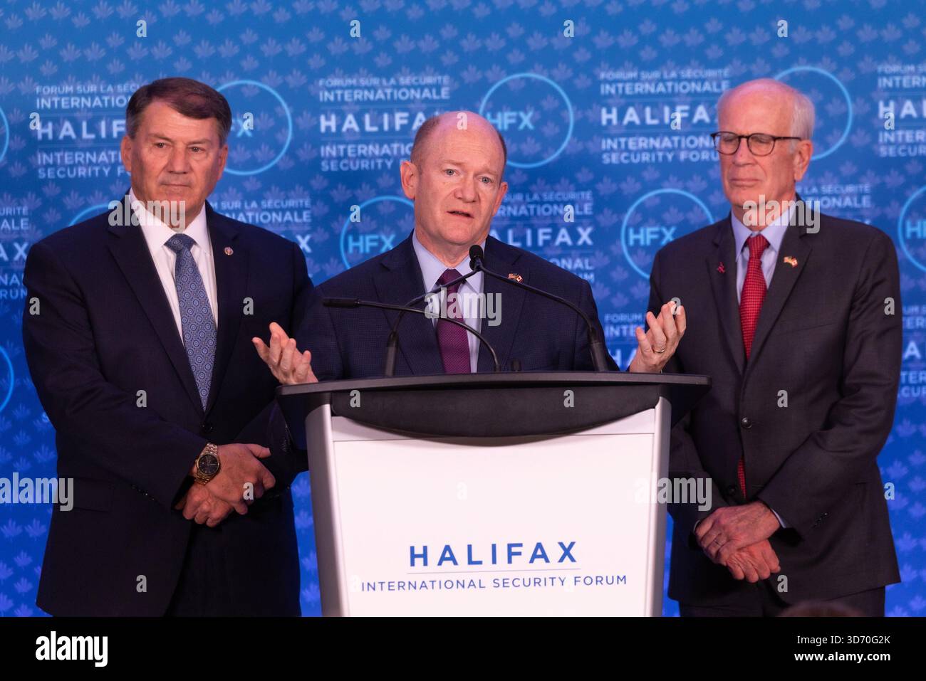 U.S. Senator Chris Coons speaks alongside senators Mike Rounds, left ...