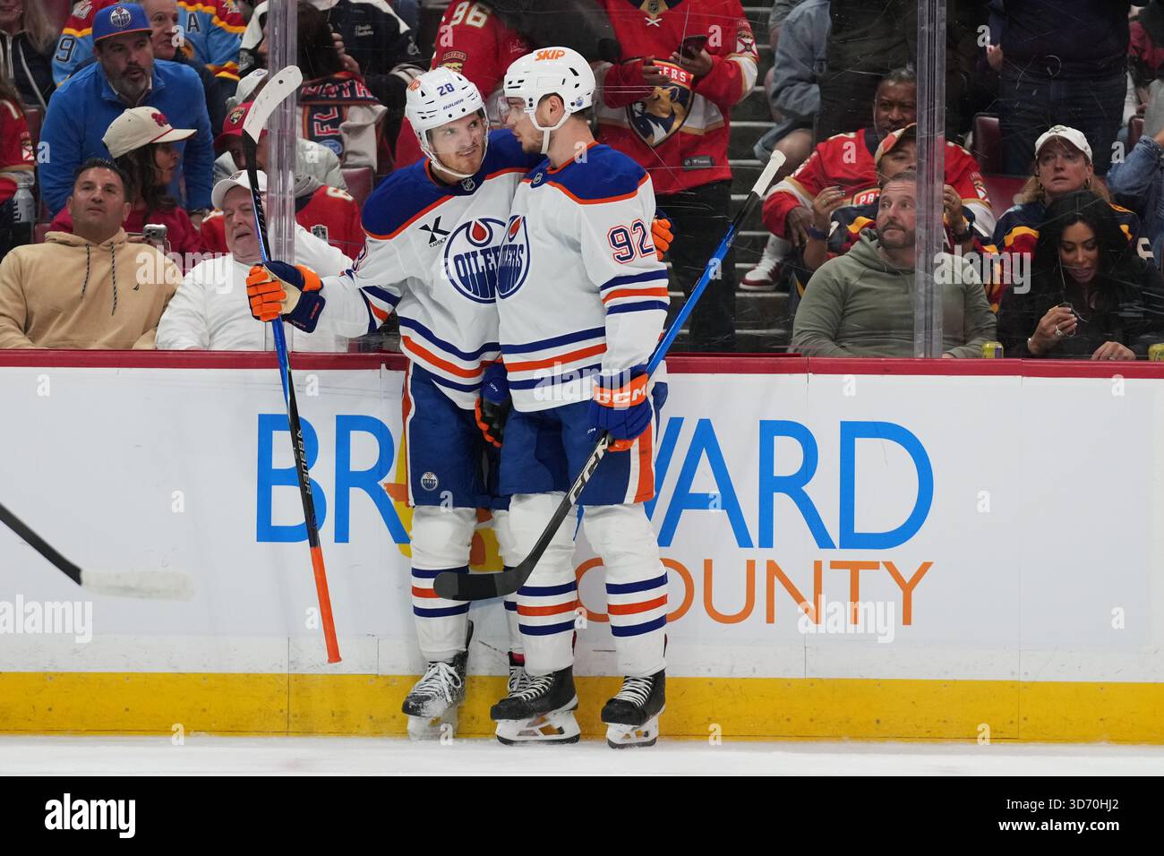 Edmonton Oilers center Jack Roslovic, left is congratulated by right ...