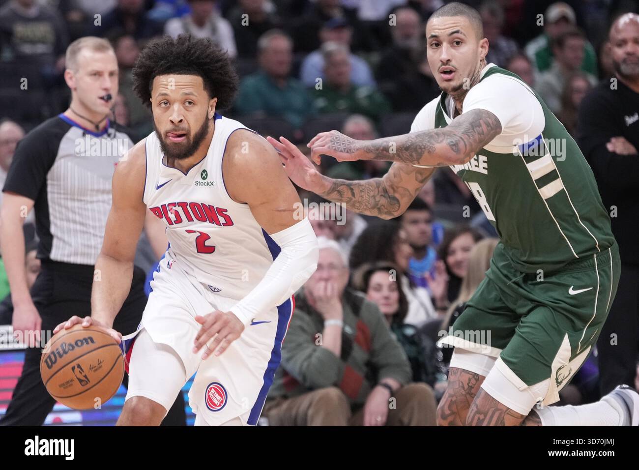 Detroit Pistons' Cade Cunningham gets past Milwaukee Bucks' Kyle Kuzma ...