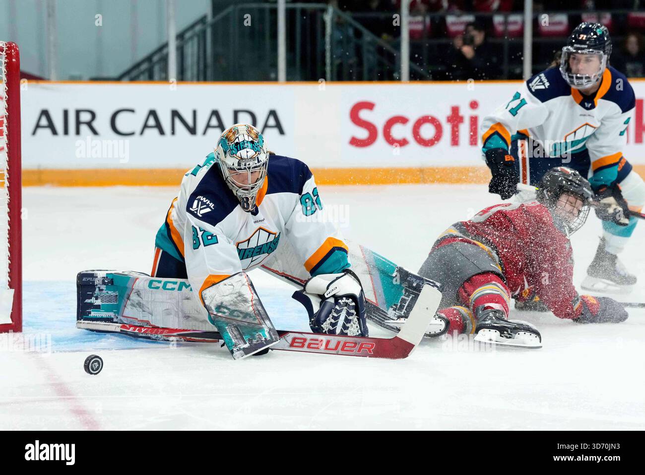 New York Sirens goaltender Kayle Osborne (82) watches the puck as ...
