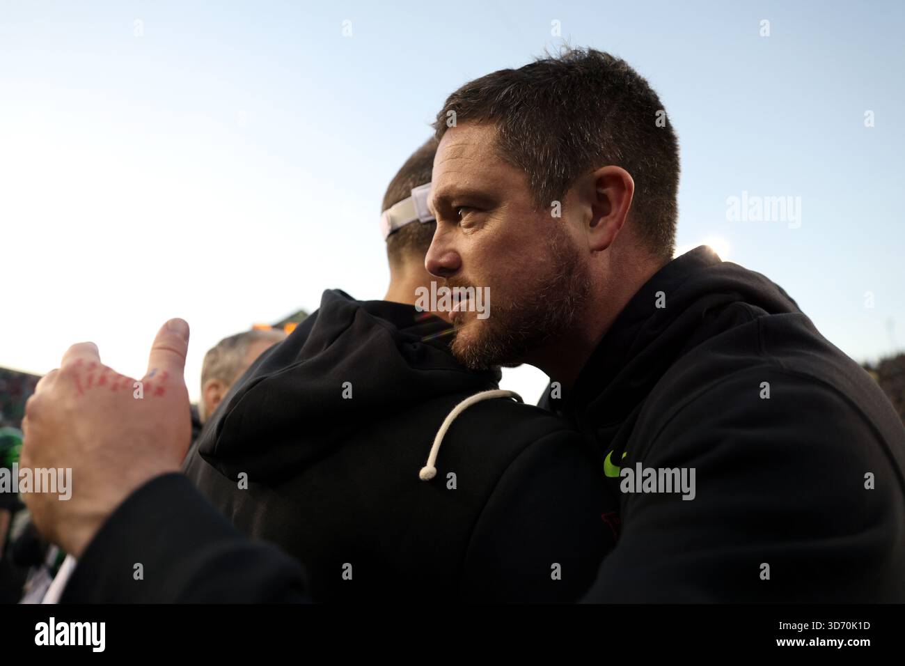 Oregon head coach Dan Lanning, front, greets Southern California head ...