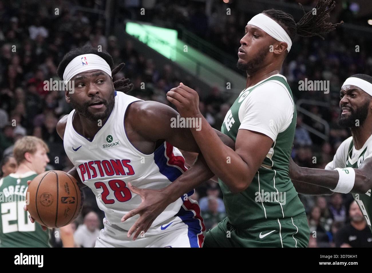 Detroit Pistons' Isaiah Stewart tries to get by Milwaukee Bucks' Myles ...