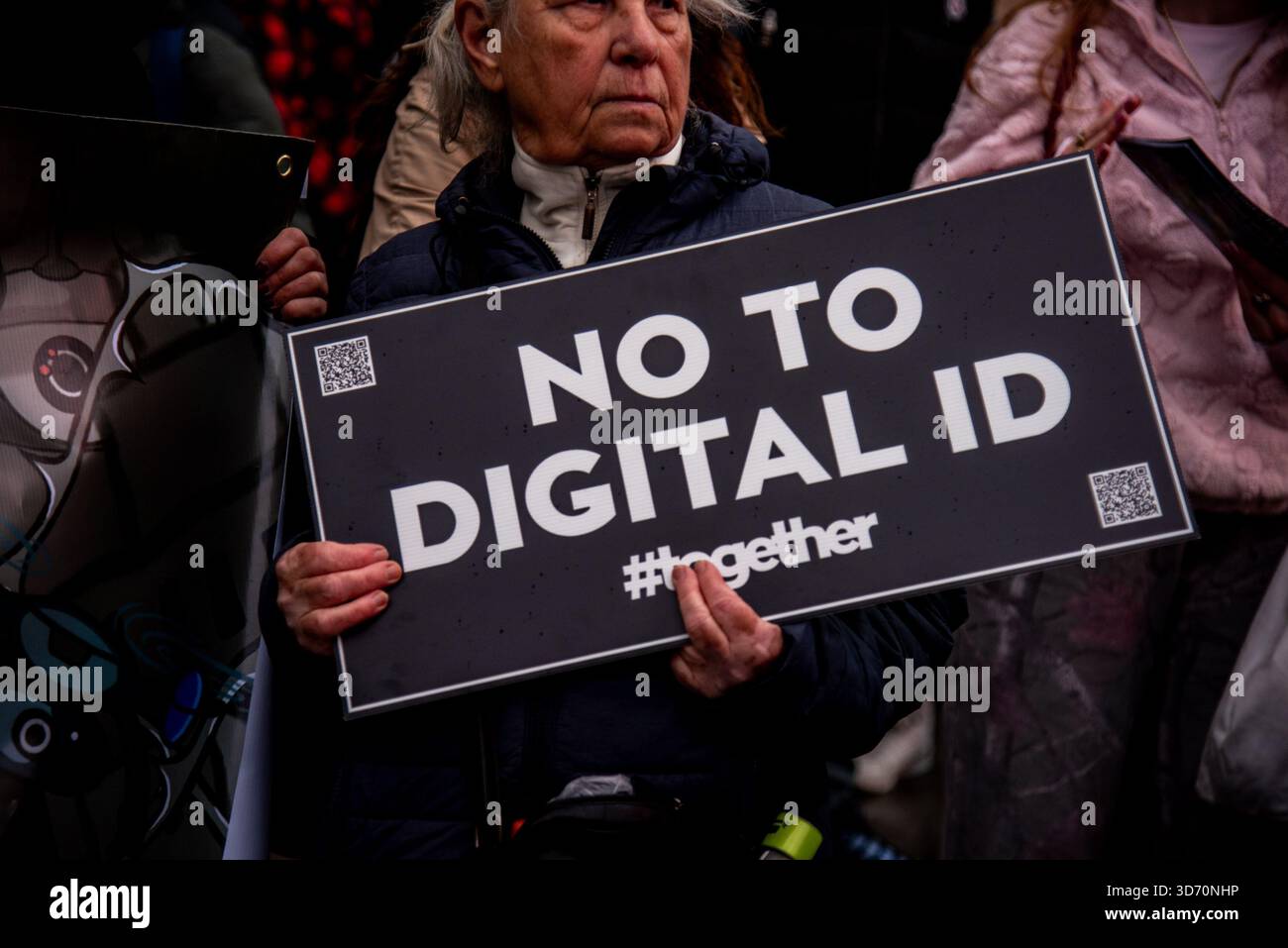 A protestor holds a placard during the Unite Against Digital ID Protest ...