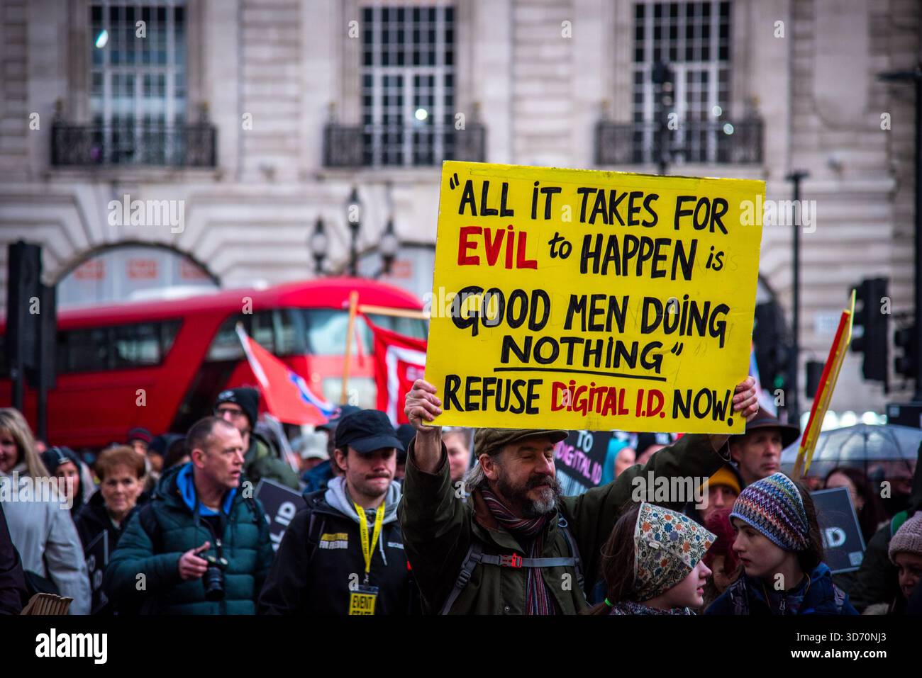 A protestor holds a placard during the Unite Against Digital ID Protest ...