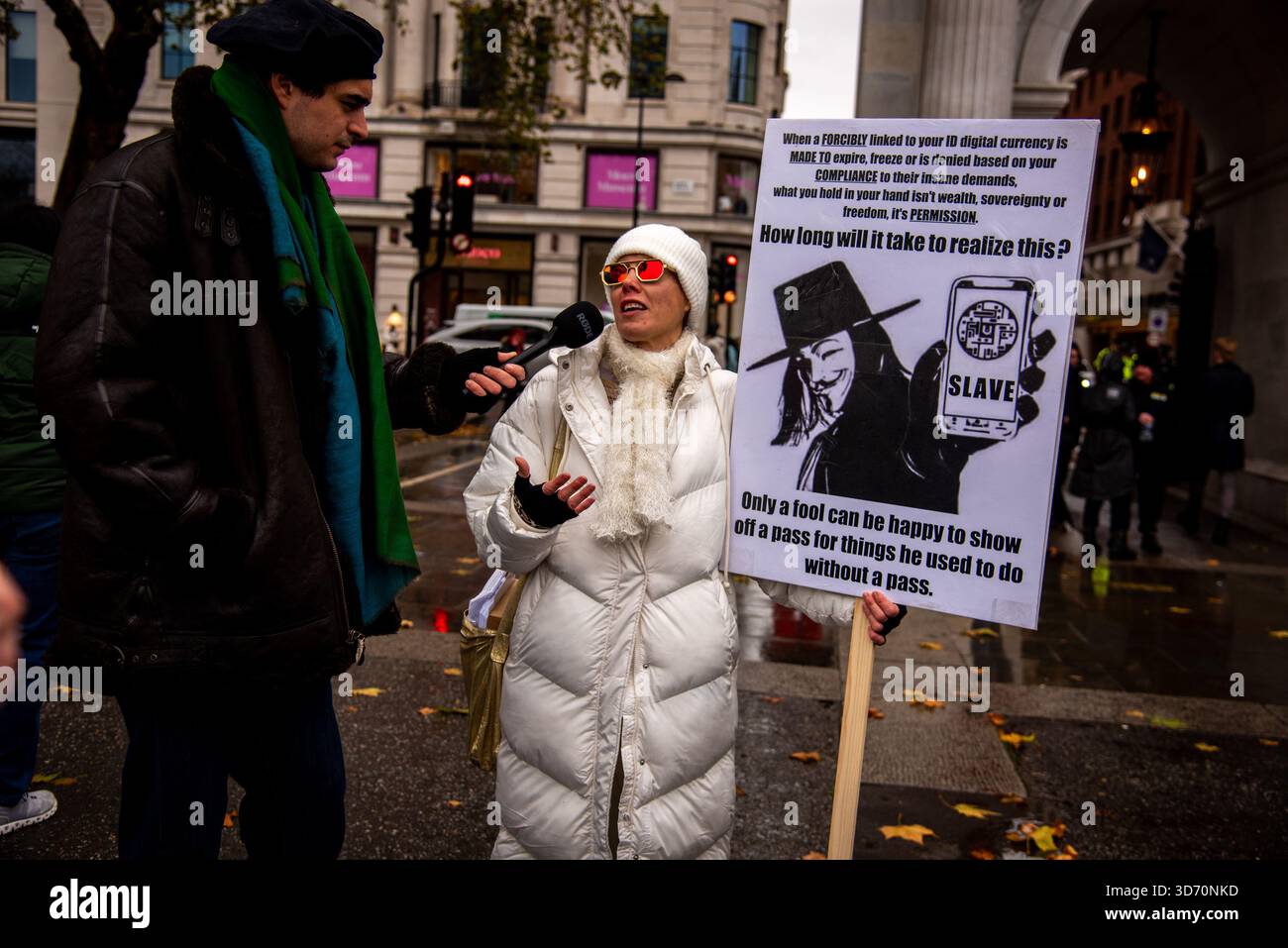 A protestor holds a placard during the Unite Against Digital ID Protest ...