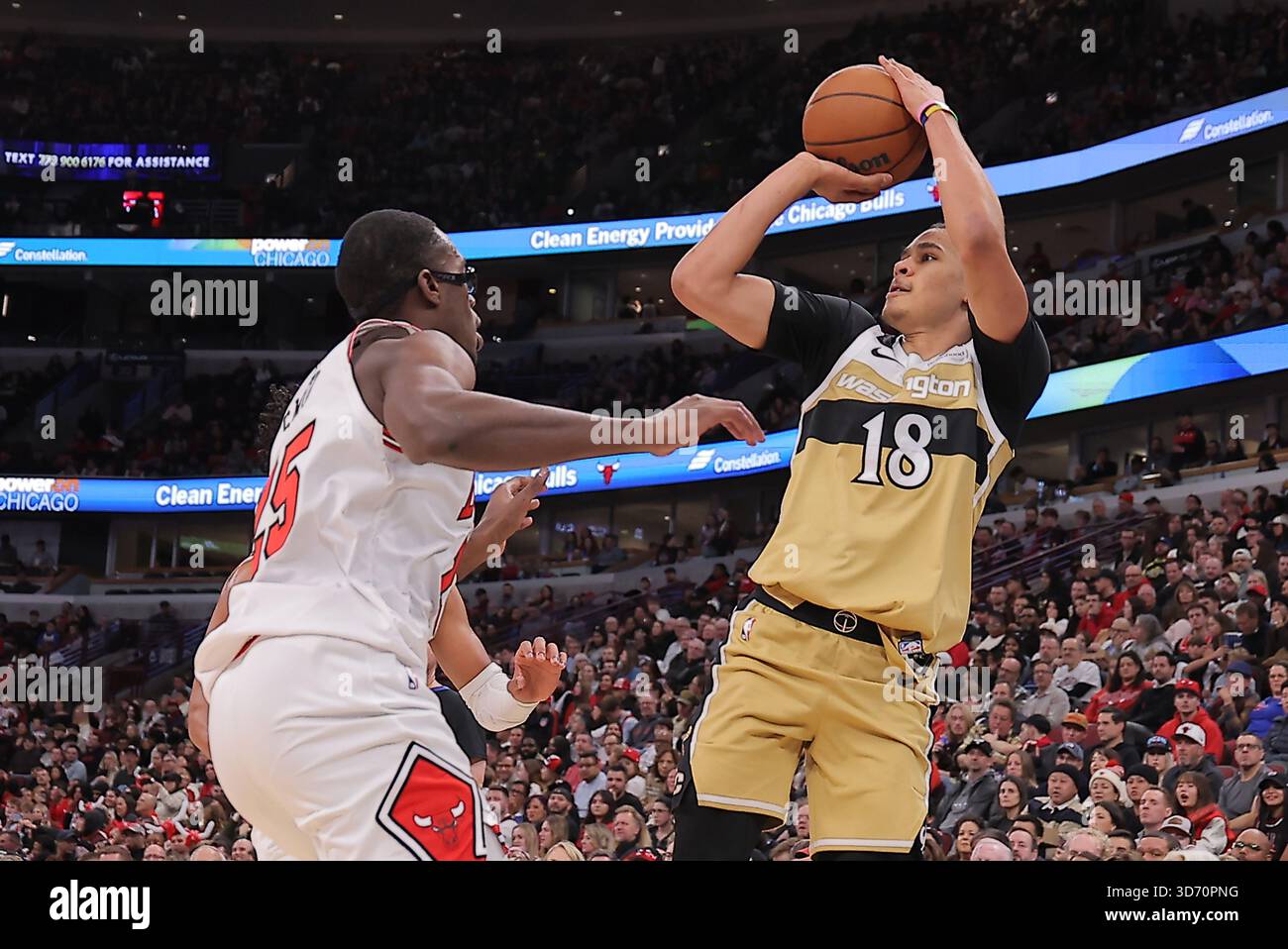 Washington Wizards forward Kyshawn George (18) shoots a three-point ...