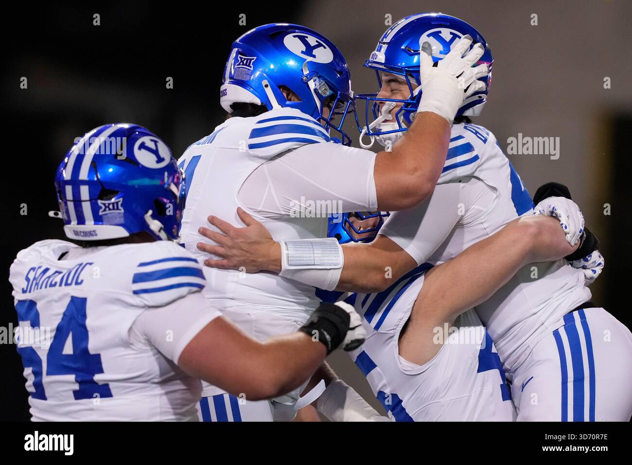 BYU quarterback Bear Bachmeier (47), top right, celebrates with ...