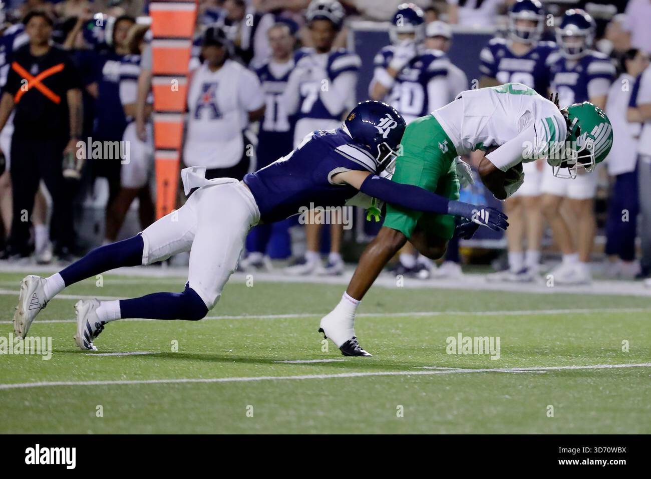 Rice linebacker Jo Chavez, left, tackles North Texas wide receiver ...