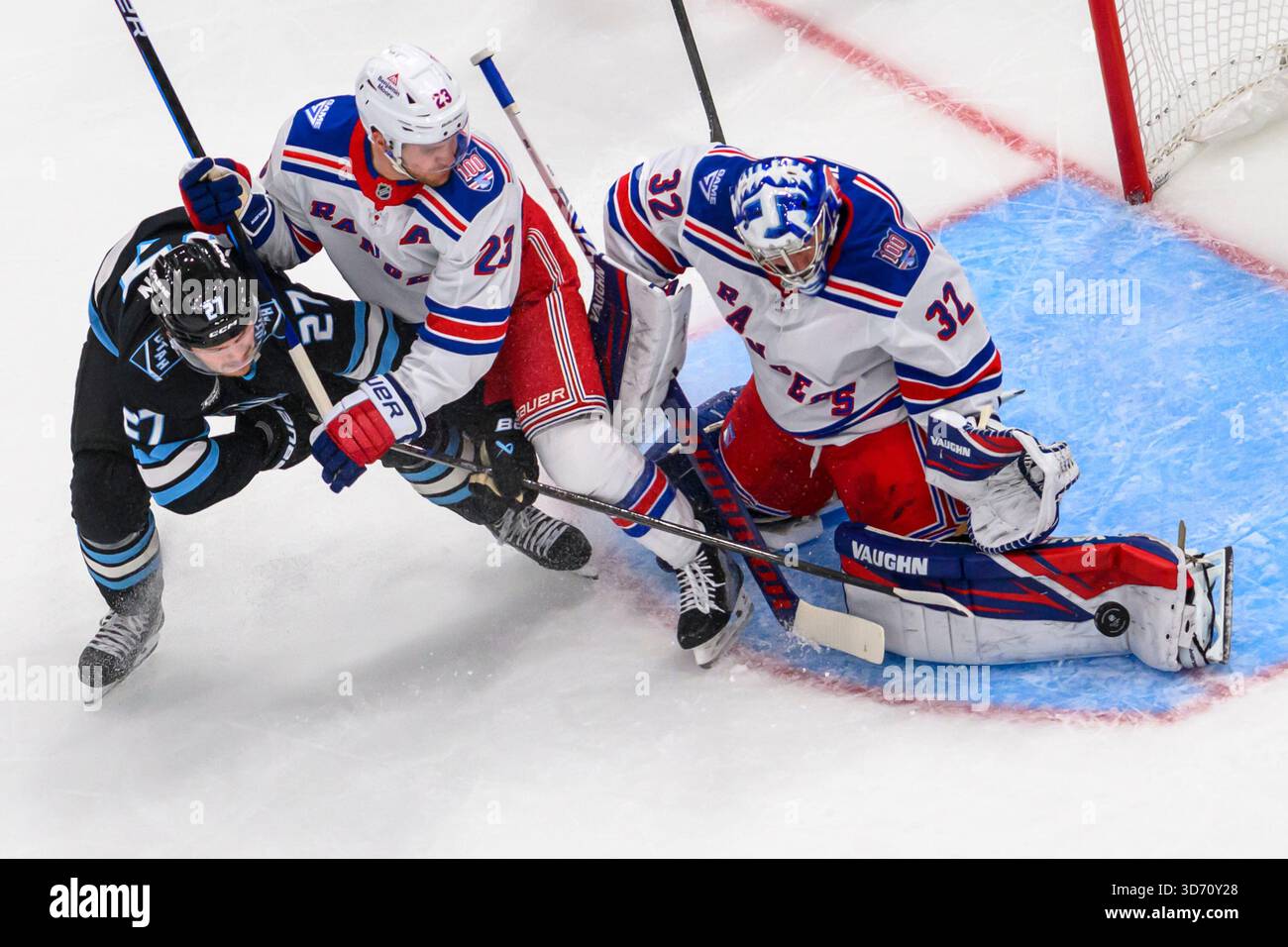 New York Rangers goaltender Jonathan Quick (32) blocks the puck from ...