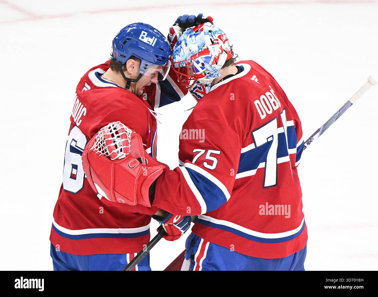 Montreal Canadiens goaltender Jakub Dobes (75) celebrates with teammate ...