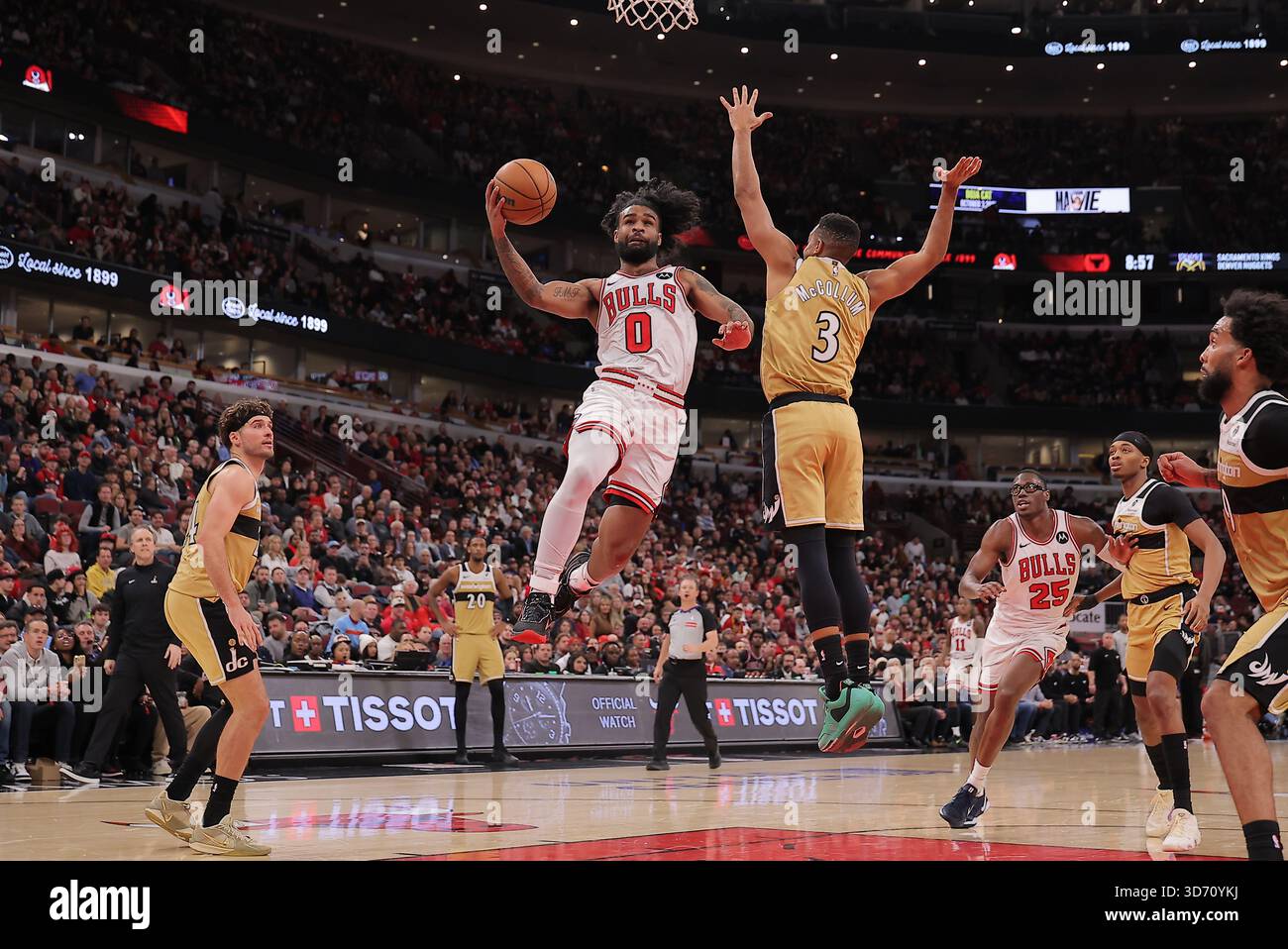Chicago Bulls guard Coby White (0) drives to the basket past Washington ...