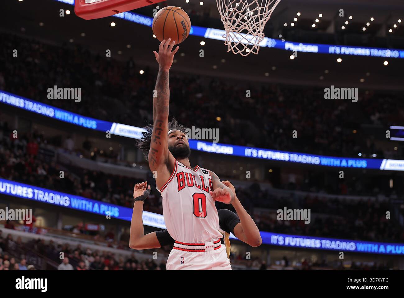 Chicago Bulls guard Coby White (0) drives to the basket for a layup ...