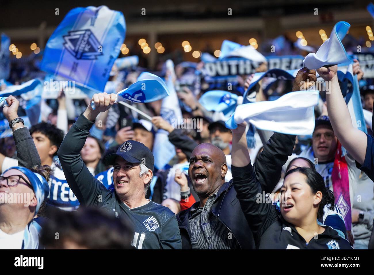 Fans wave flags and towels before the Vancouver Whitecaps and Los ...