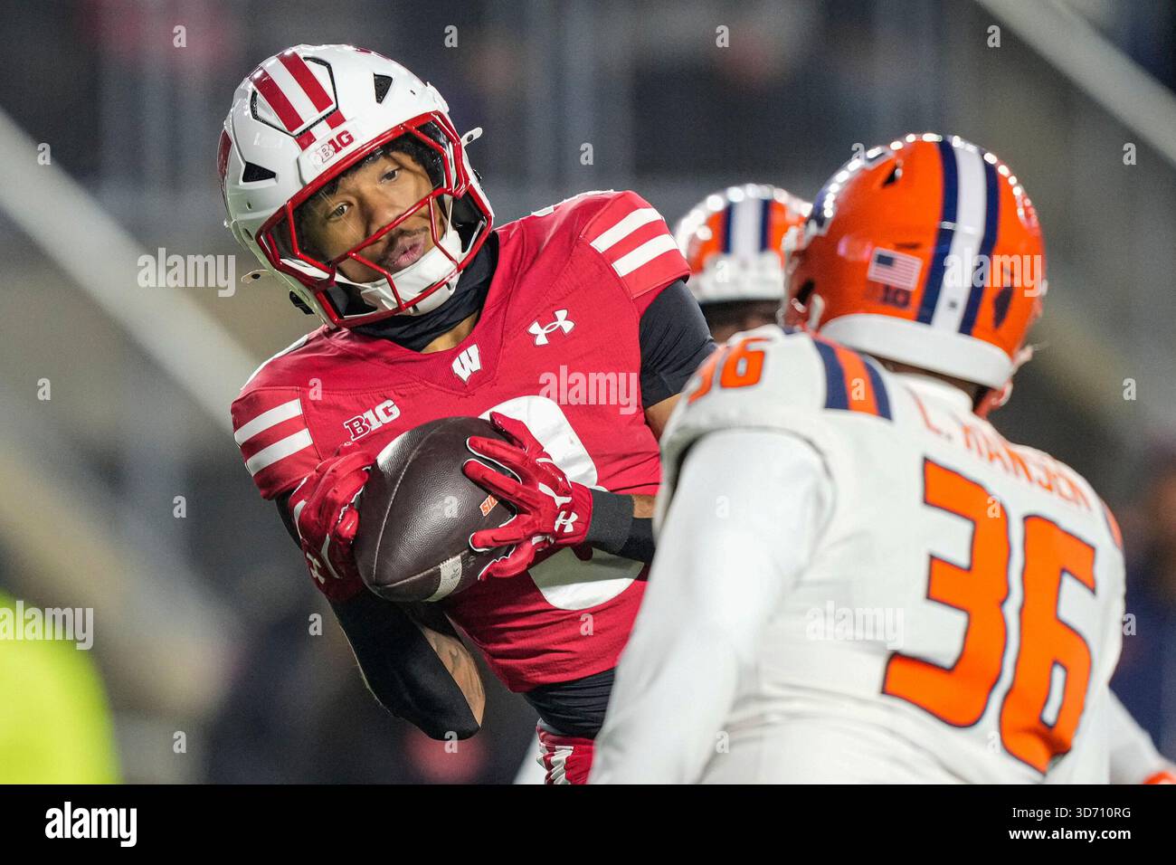 Wisconsin wide receiver Tyrell Henry, left, catches a pass against ...