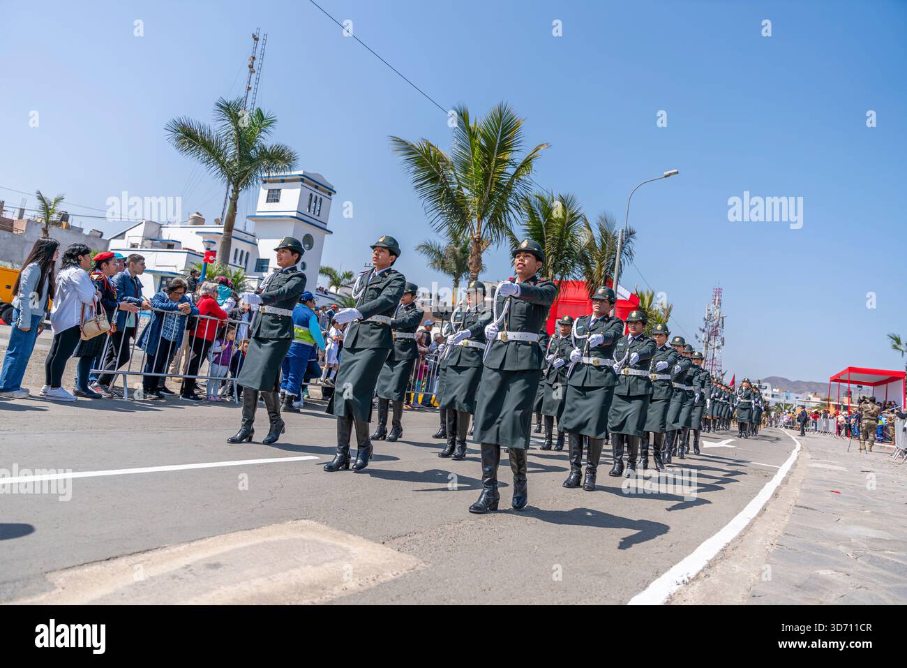 Female police officers march in formation during a civic parade as ...