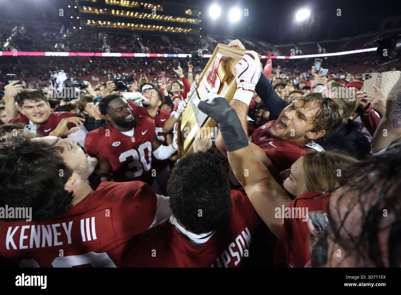 Stanford celebrates with the Stanford Axe after defeating California ...