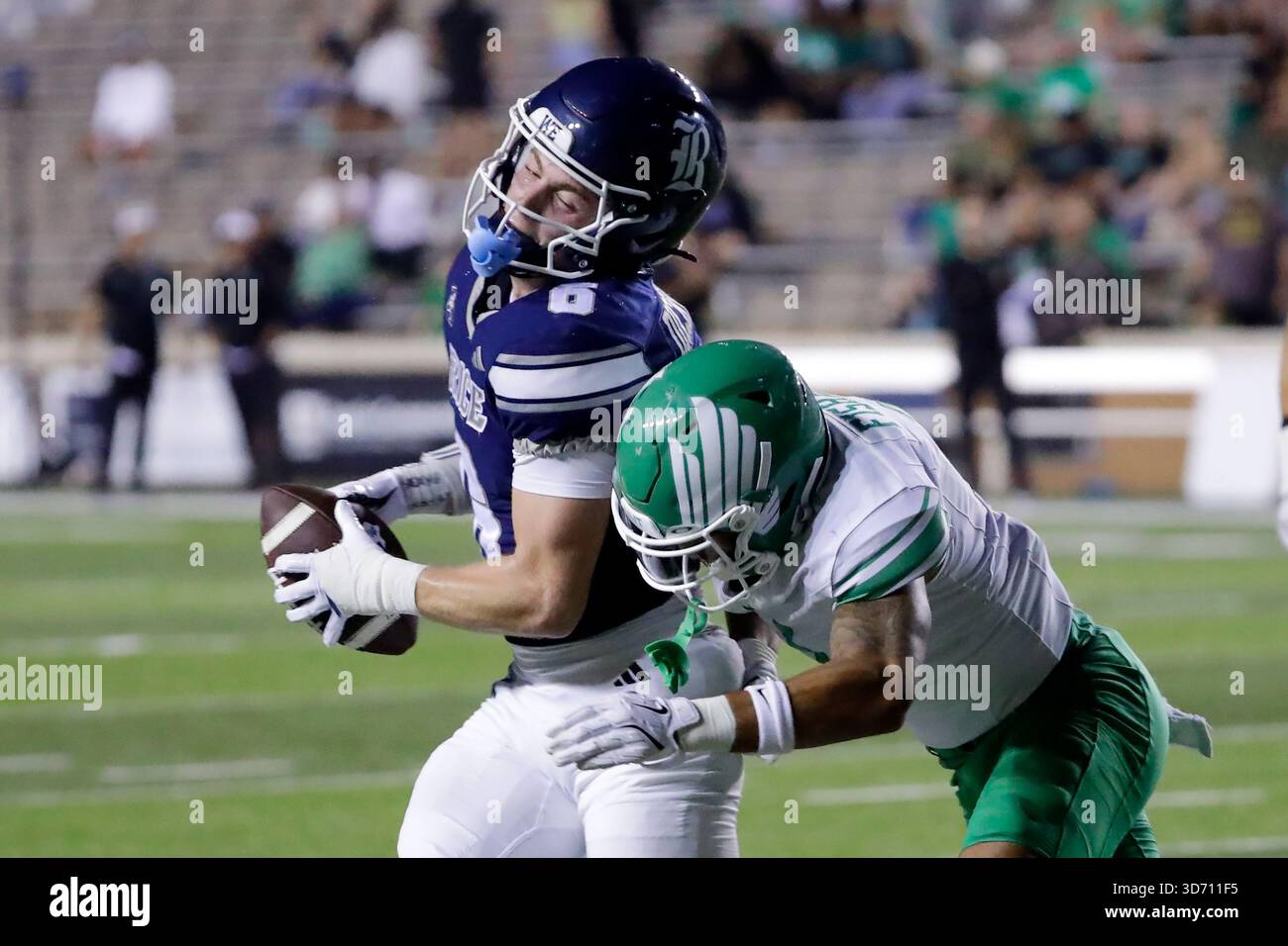 Rice wide receiver Drayden Dickmann, left, is hit in the back on the ...
