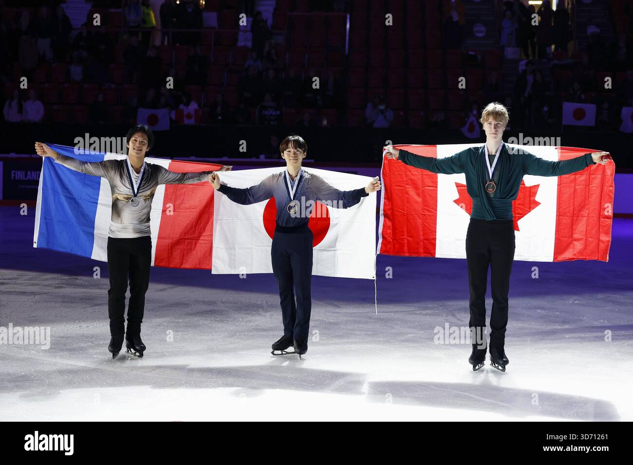Yuma Kagiyama (C) of Japan poses after winning gold in the men's event ...
