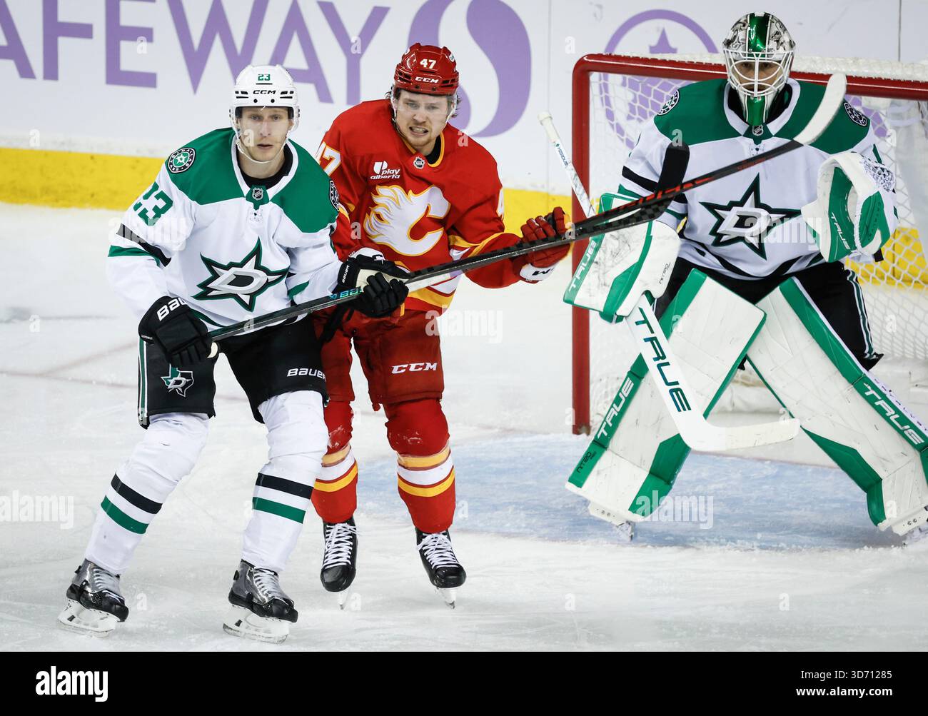 Dallas Stars' Esa Lindell, left, battles for position with Calgary ...