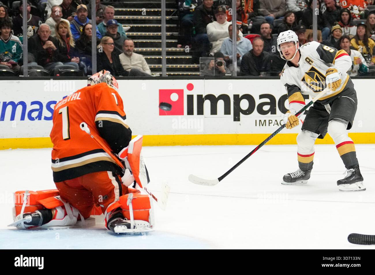 Vegas Golden Knights center Jack Eichel, right, puts a shot on goal as ...
