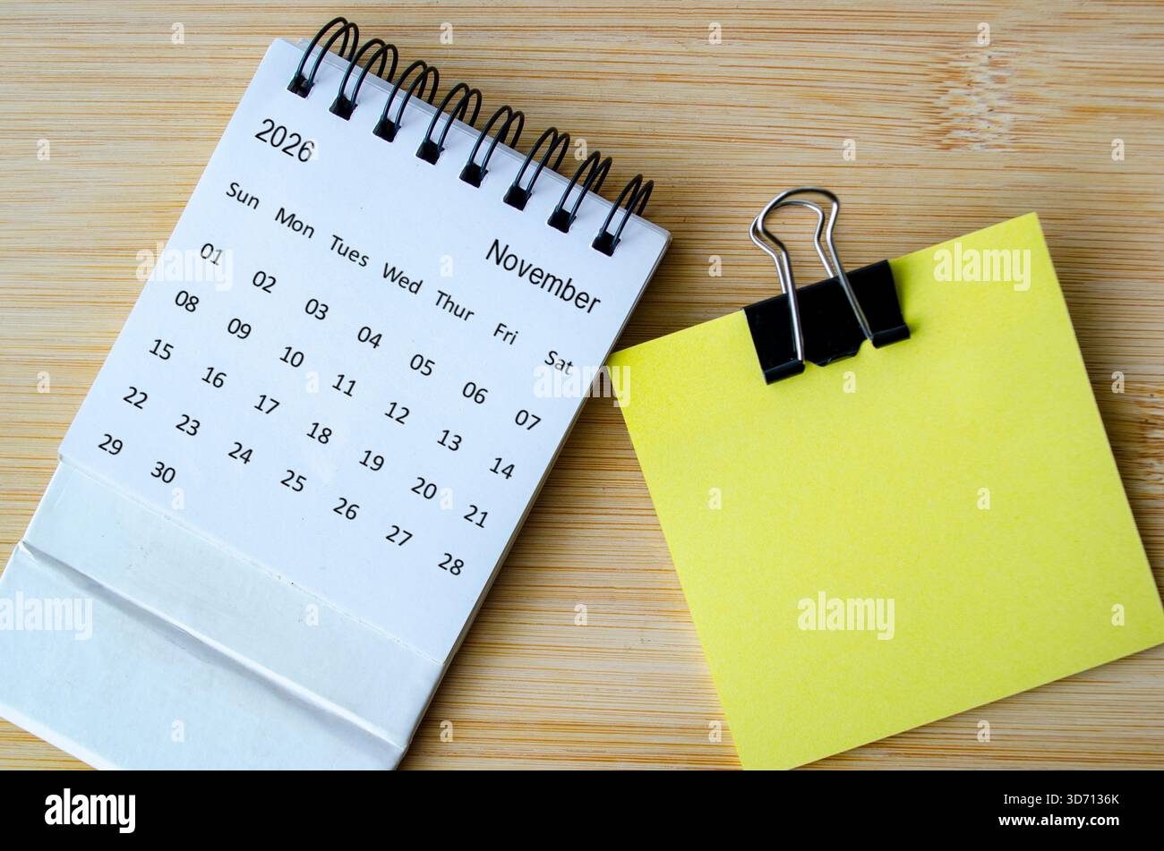 Top view of November 2026 Calendar with blank sticky note with ...