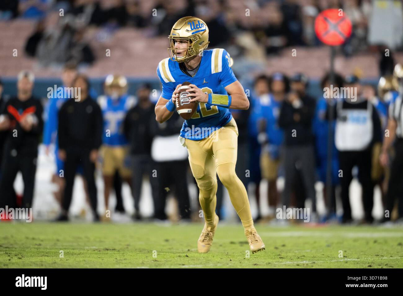 UCLA quarterback Luke Duncan (12) runs with the ball during the second ...