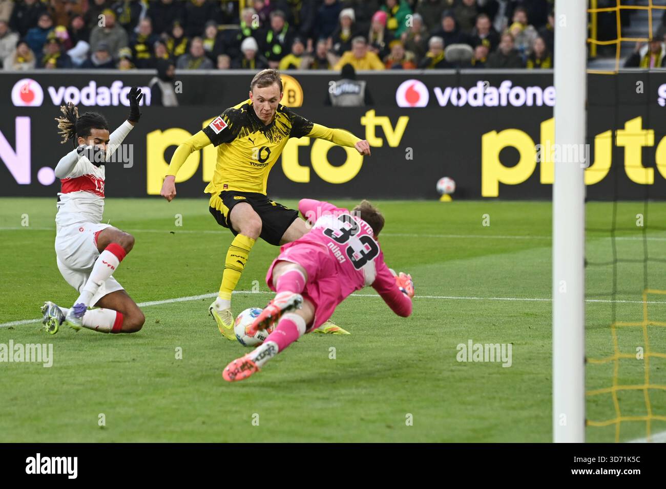 Maximilian BEIER (DO) scores the goal for 2-0 against goalkeeper ...