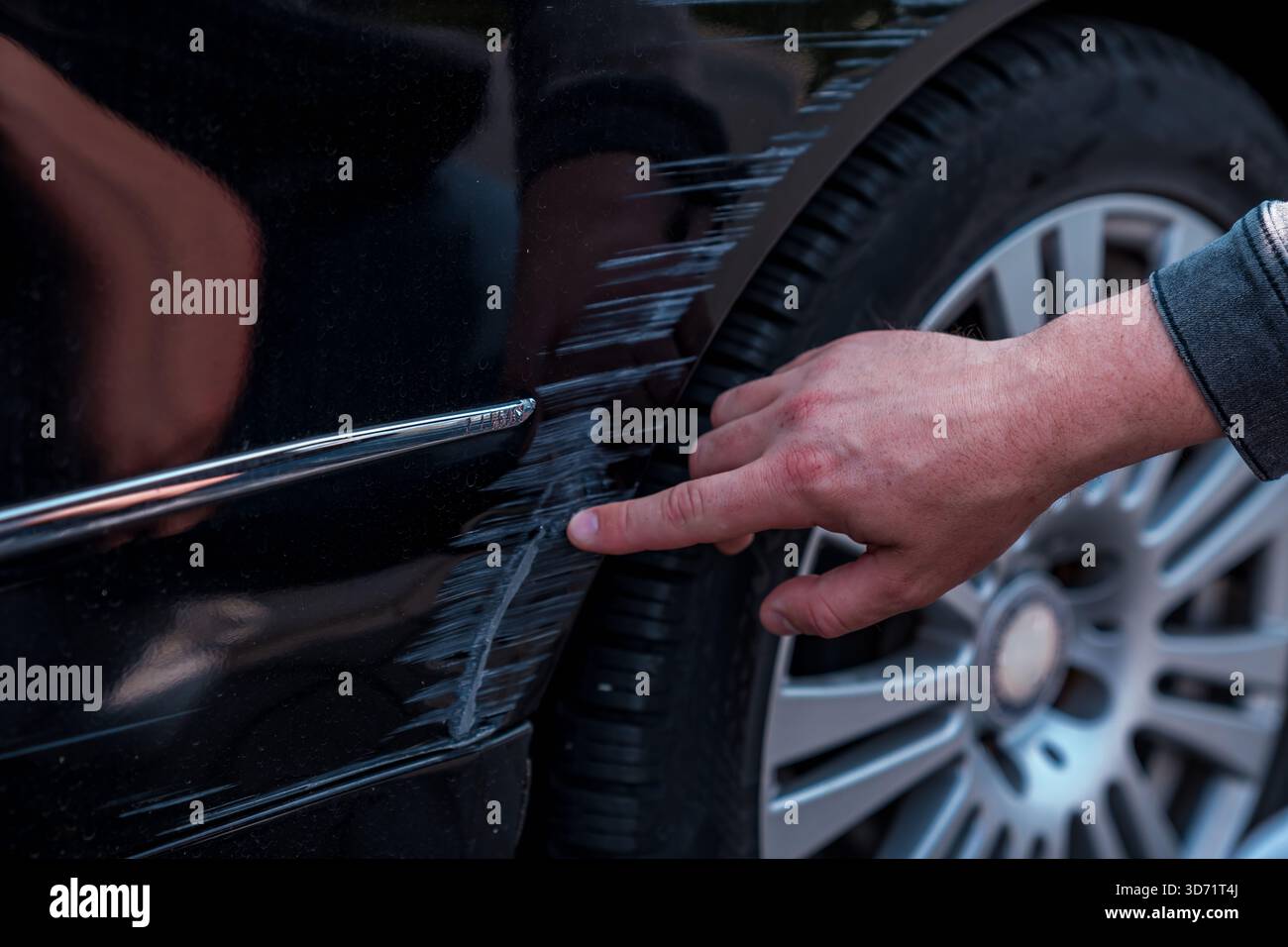 Black man examining blue hi-res stock photography and images - Alamy