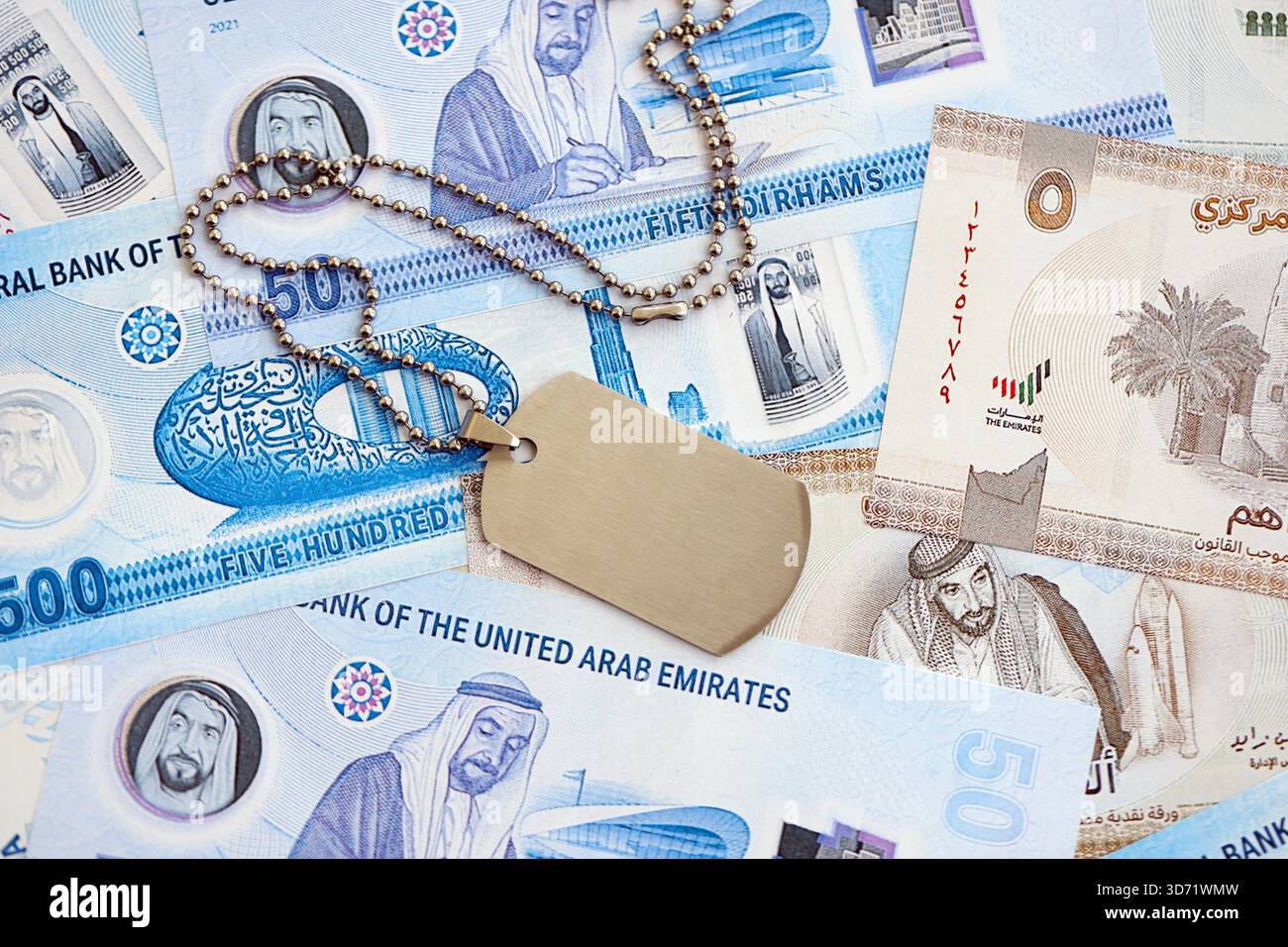United Arab Emirates dirham currency money bills and military token ...