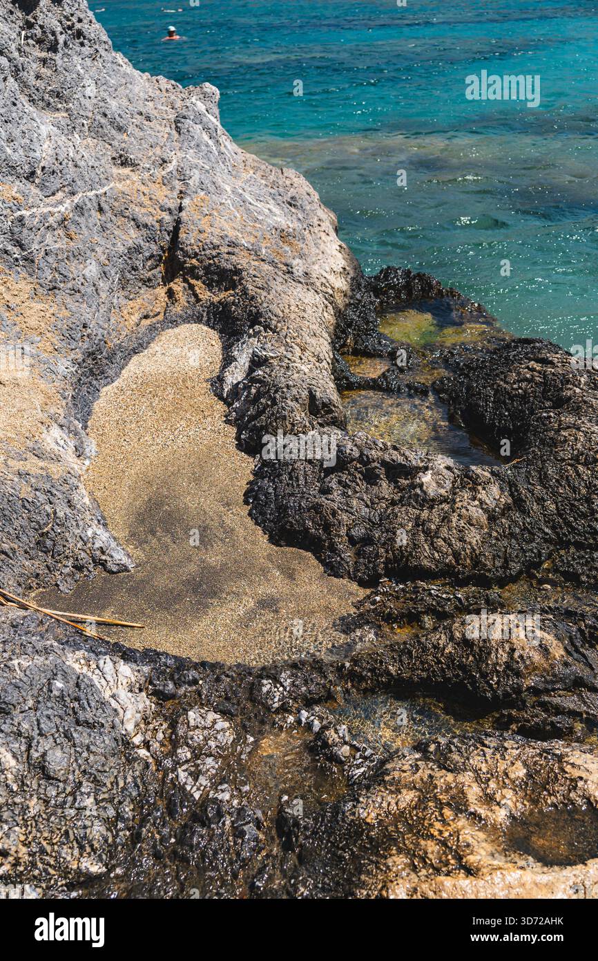 close-up of basins filled with salt water formed as a result of salt ...