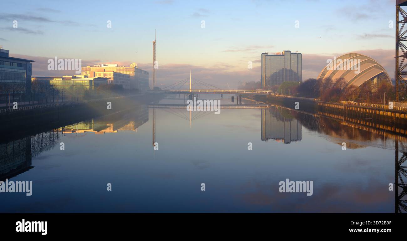 A serene view of the River Clyde in Glasgow, Scotland at dawn ...